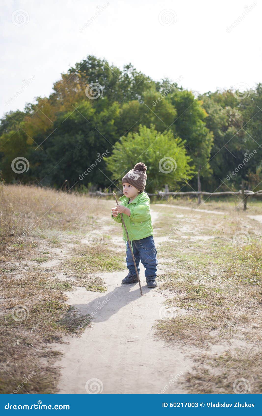 A boy with a stick. stock image. Image of twig, road - 60217003