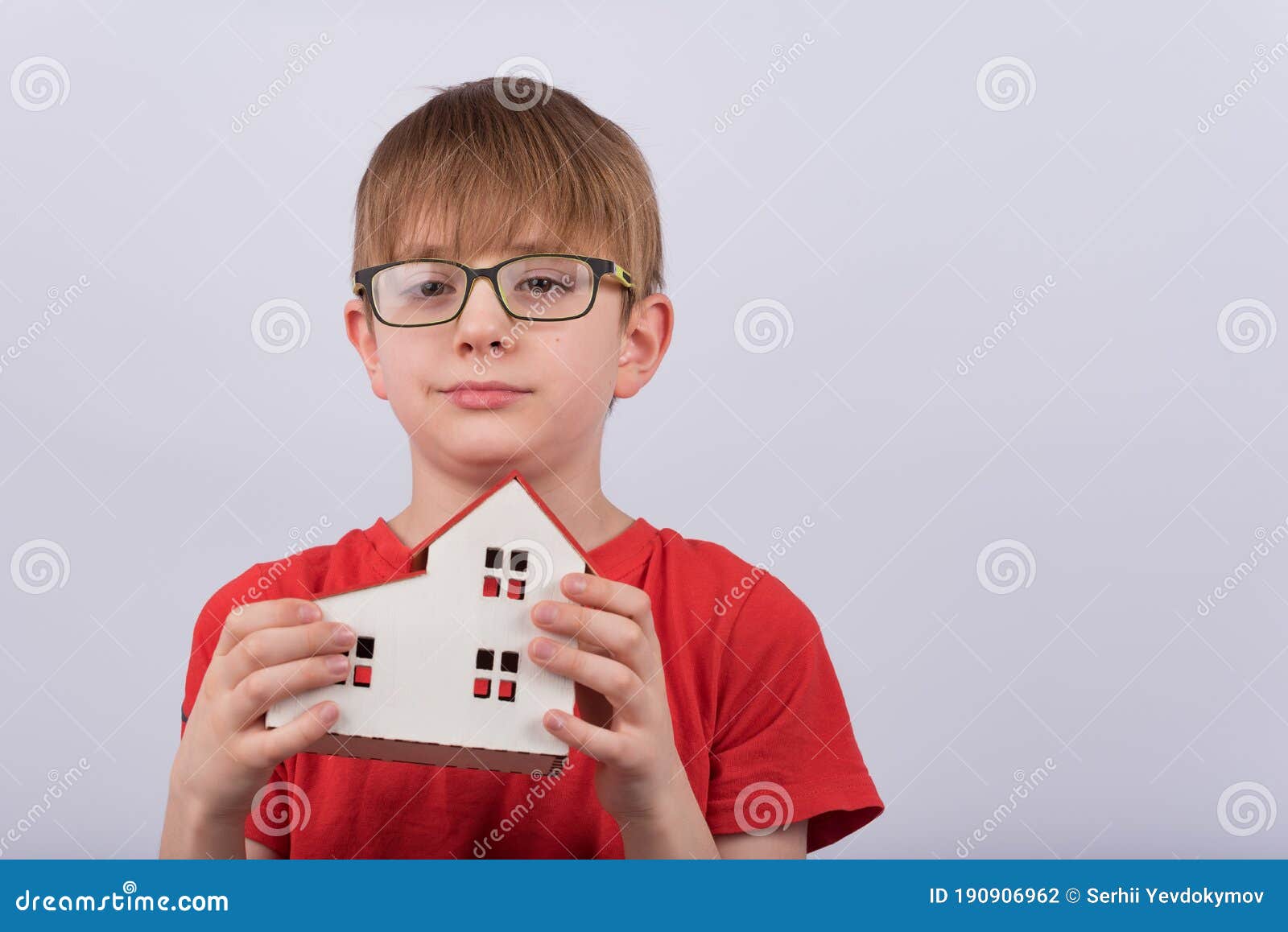 Boy Student Holding a Model House. Homeschooling Concept Stock Photo ...