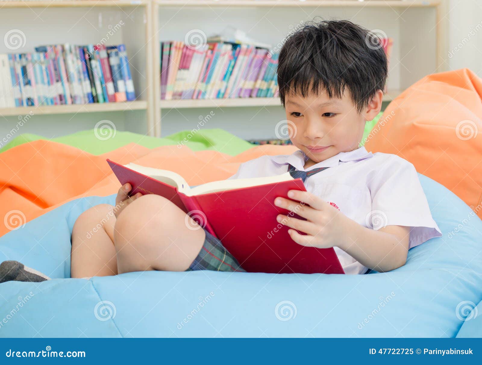 Boy Student Reading Book in Library Stock Image - Image of grade, happy ...