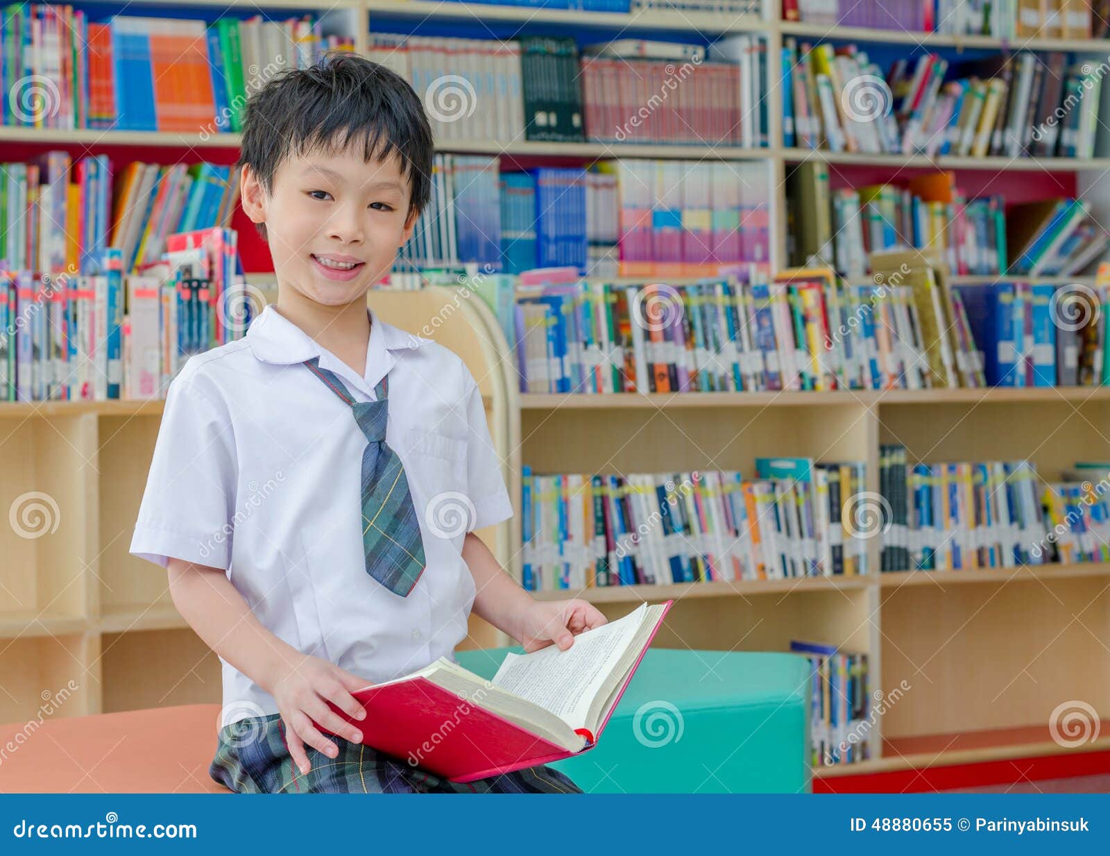 Boy Student Reading Book in Library Stock Image - Image of primary ...