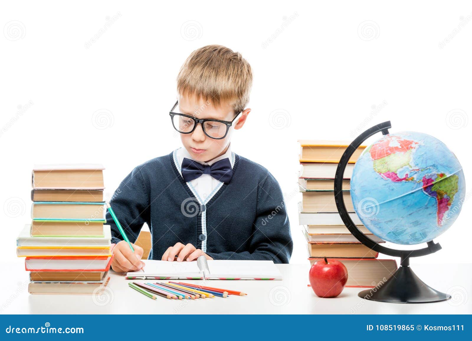 Boy Student at the Table Alone Doing Homework on a White Stock Image ...