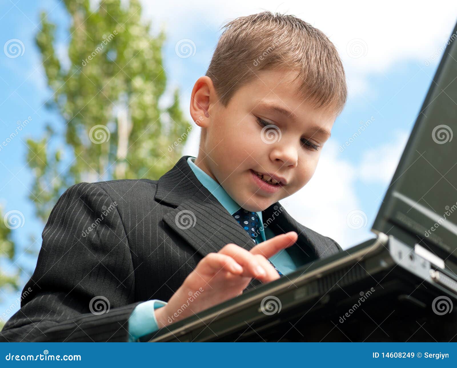 Boy studies outside stock image. Image of childhood, computer - 14608249