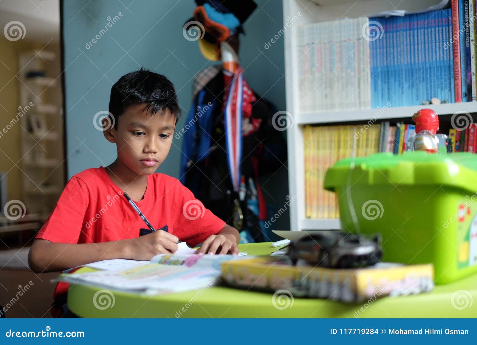 A boy study at his bedroom stock photo. Image of male - 117719284
