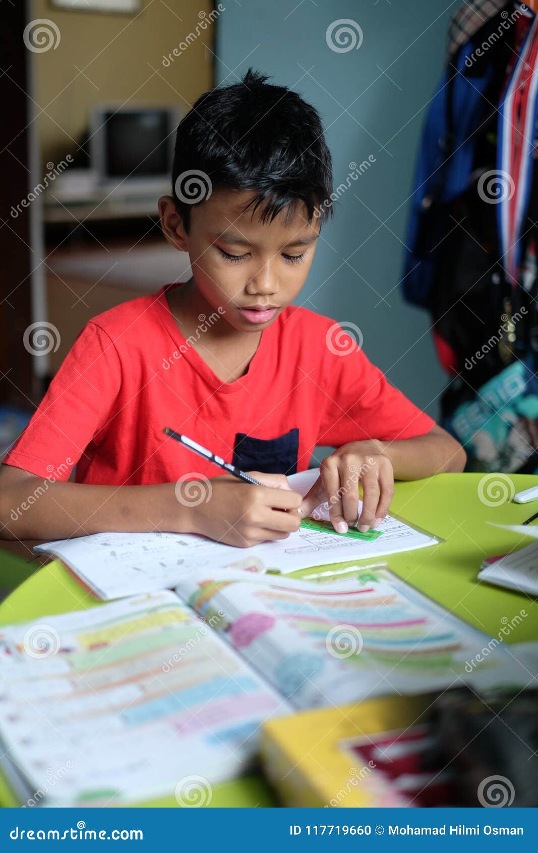 A boy study at his bedroom stock photo. Image of reading - 117719660
