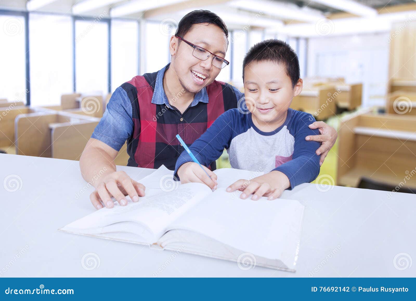 Boy Studying in the Class with Male Tutor Stock Photo - Image of ...