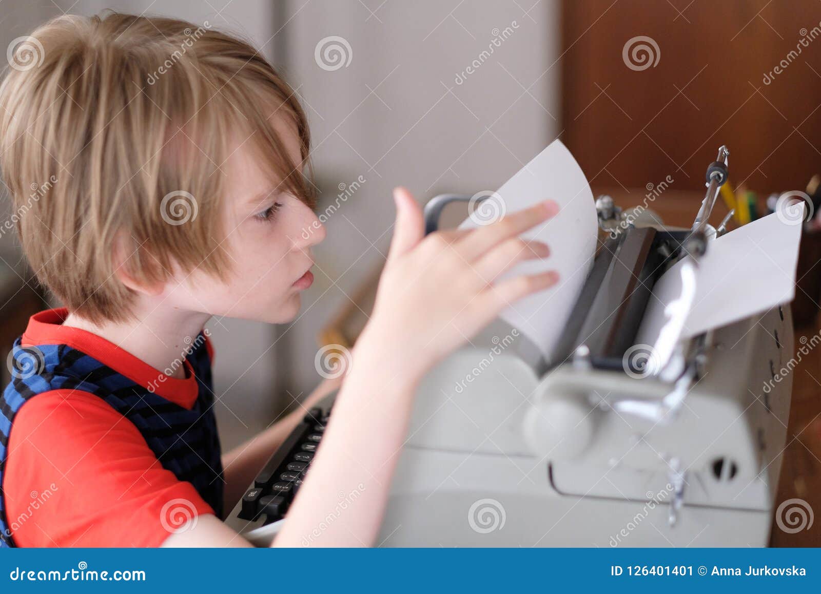 Boy Studying a Electric Typewriter Stock Image - Image of device, paper ...