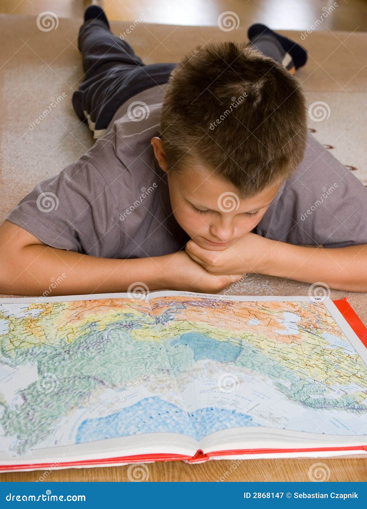 Boy studying a map stock image. Image of intelligent, interested - 2868147