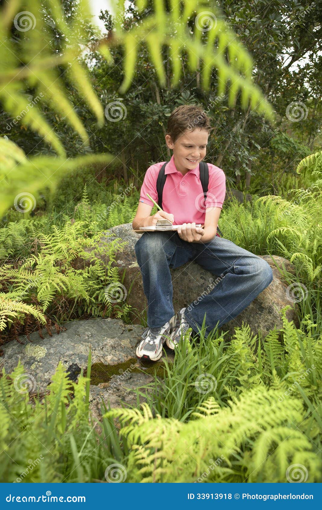 Boy Studying Plants and Writing on Clipboard Stock Photo - Image of ...