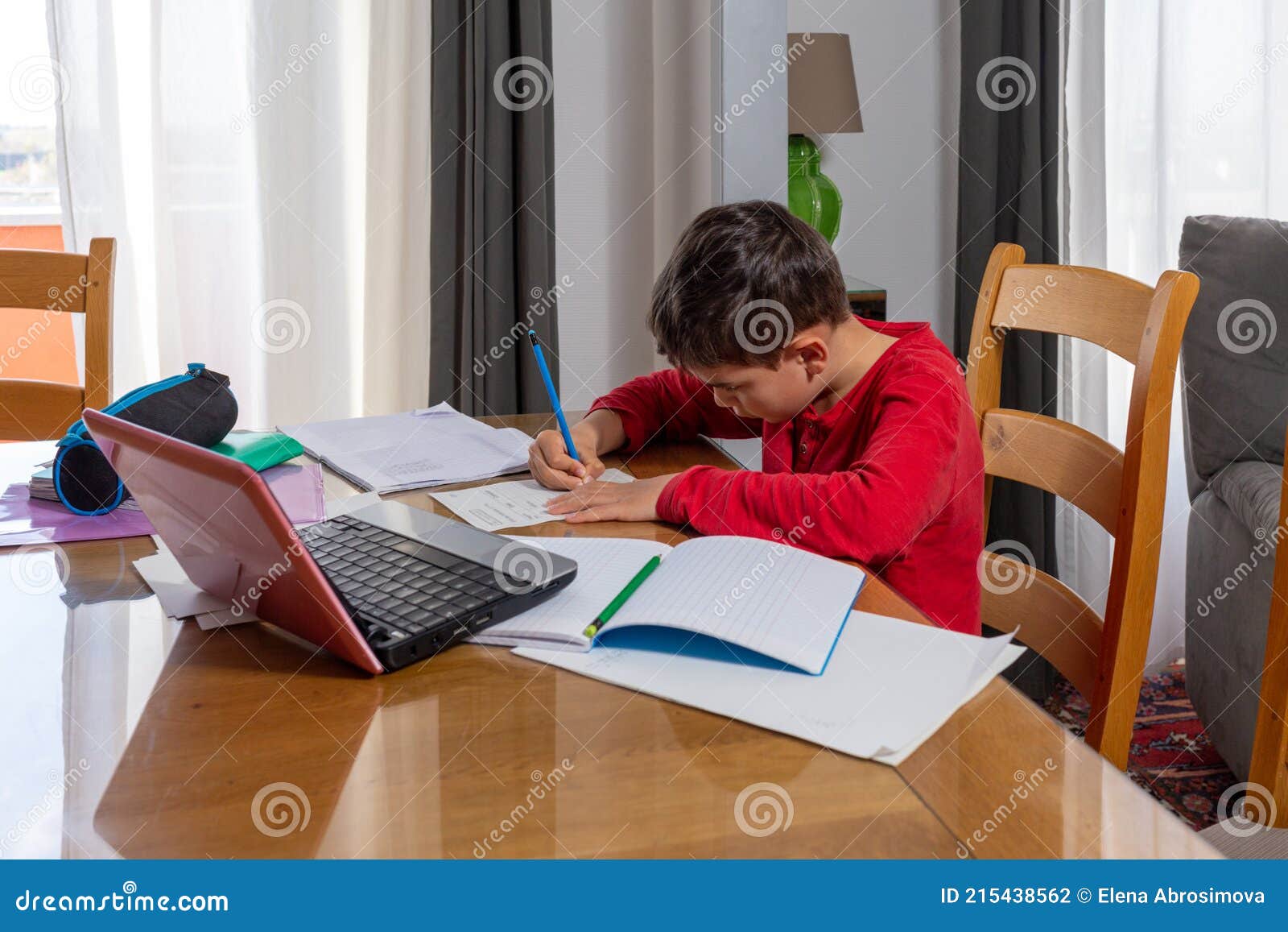 Boy Doing His Homework while Lock Down, Studying Remotely Stock Photo ...