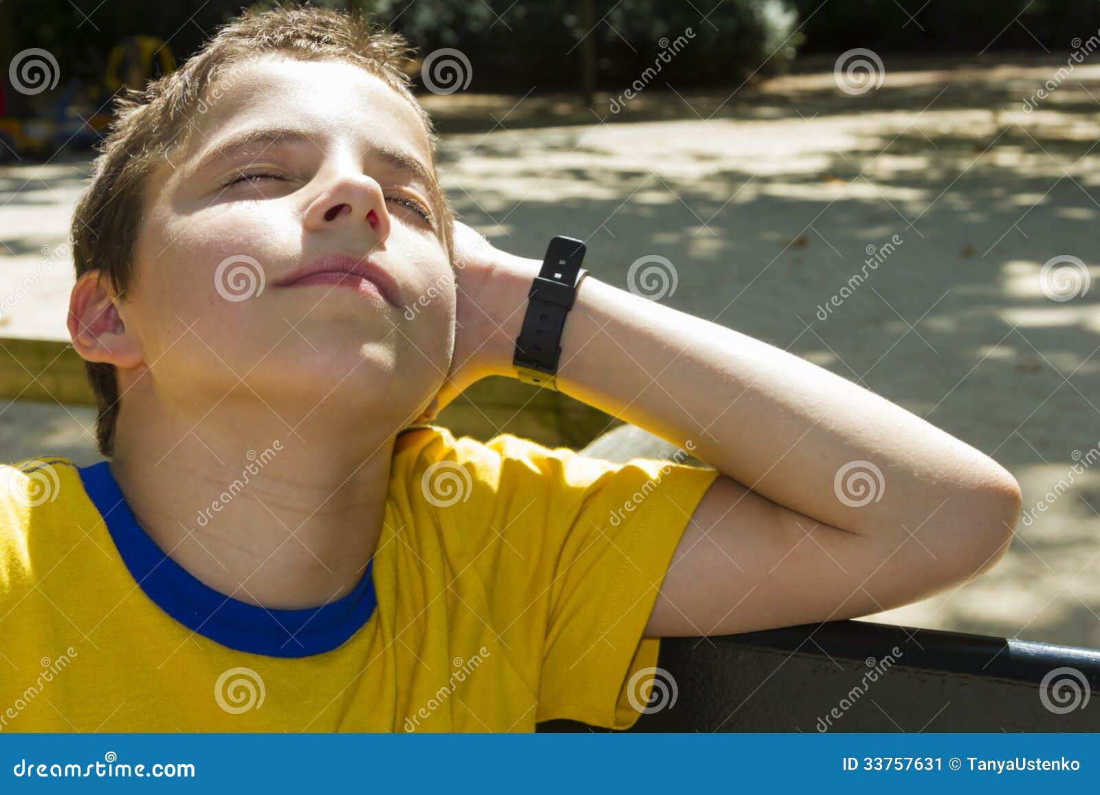 Boy sunbathing in the sun stock image. Image of blue - 33757631