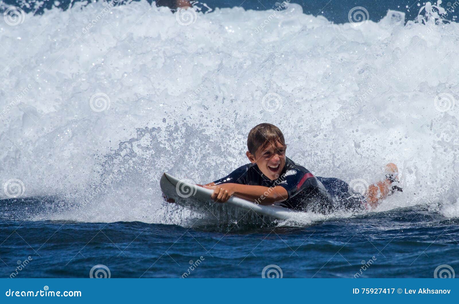 Boy surfing on Maui. editorial photography. Image of style - 75927417