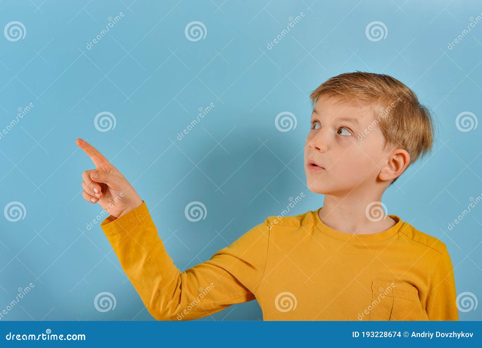A Boy with a Surprised Face Pokes a Finger Up Stock Photo - Image of ...