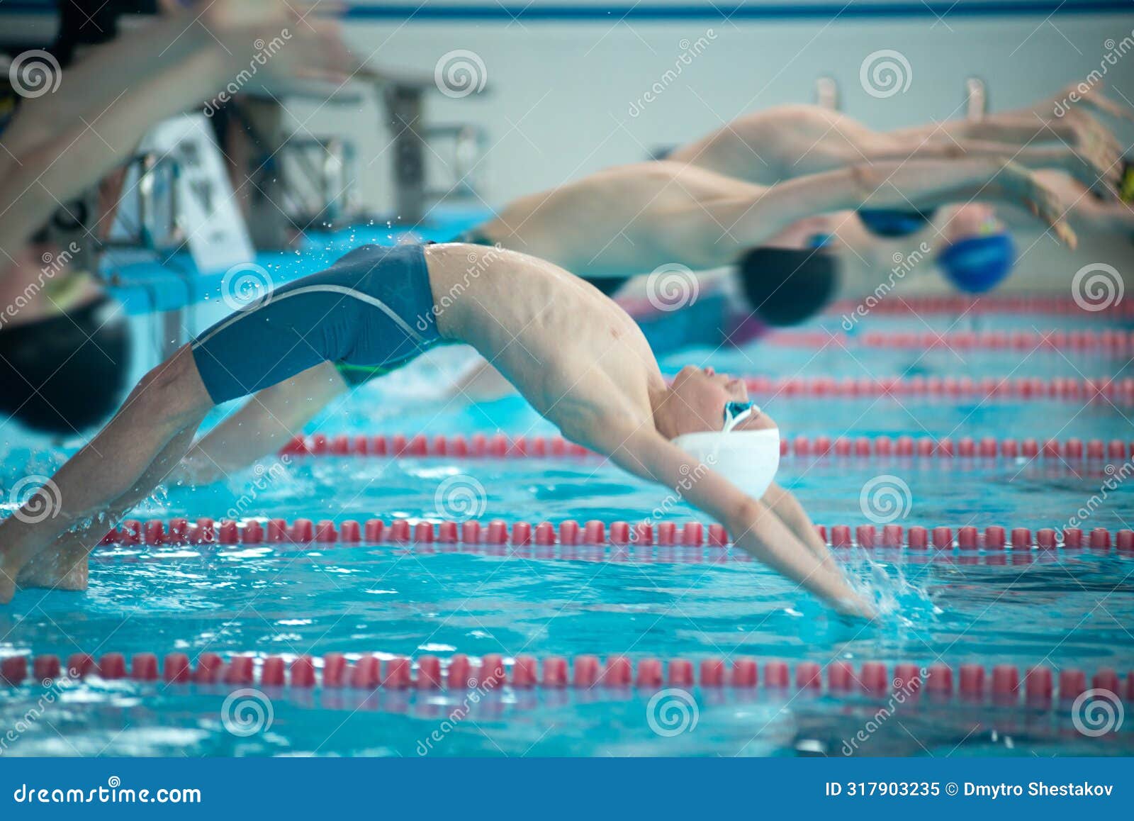 Boy Swimmers Start with Backstroke Swimming Style in the Pool Stock ...