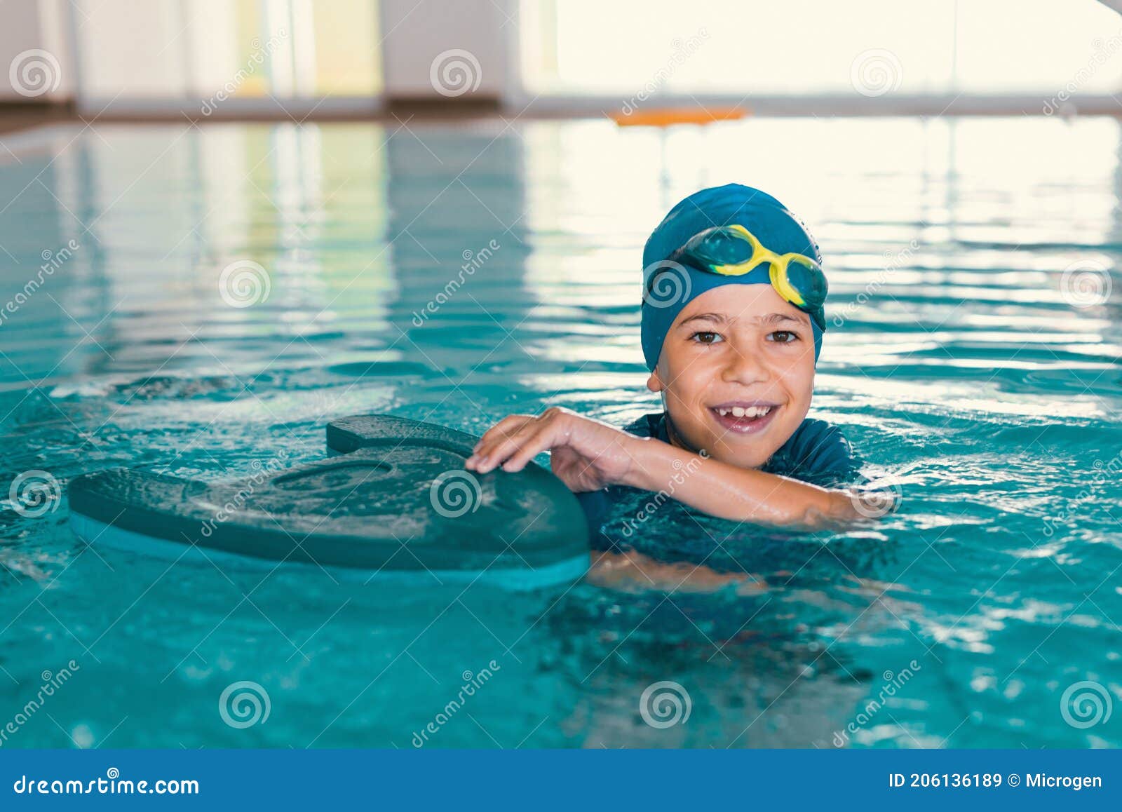 Boy on swimming class stock image. Image of indoors - 206136189