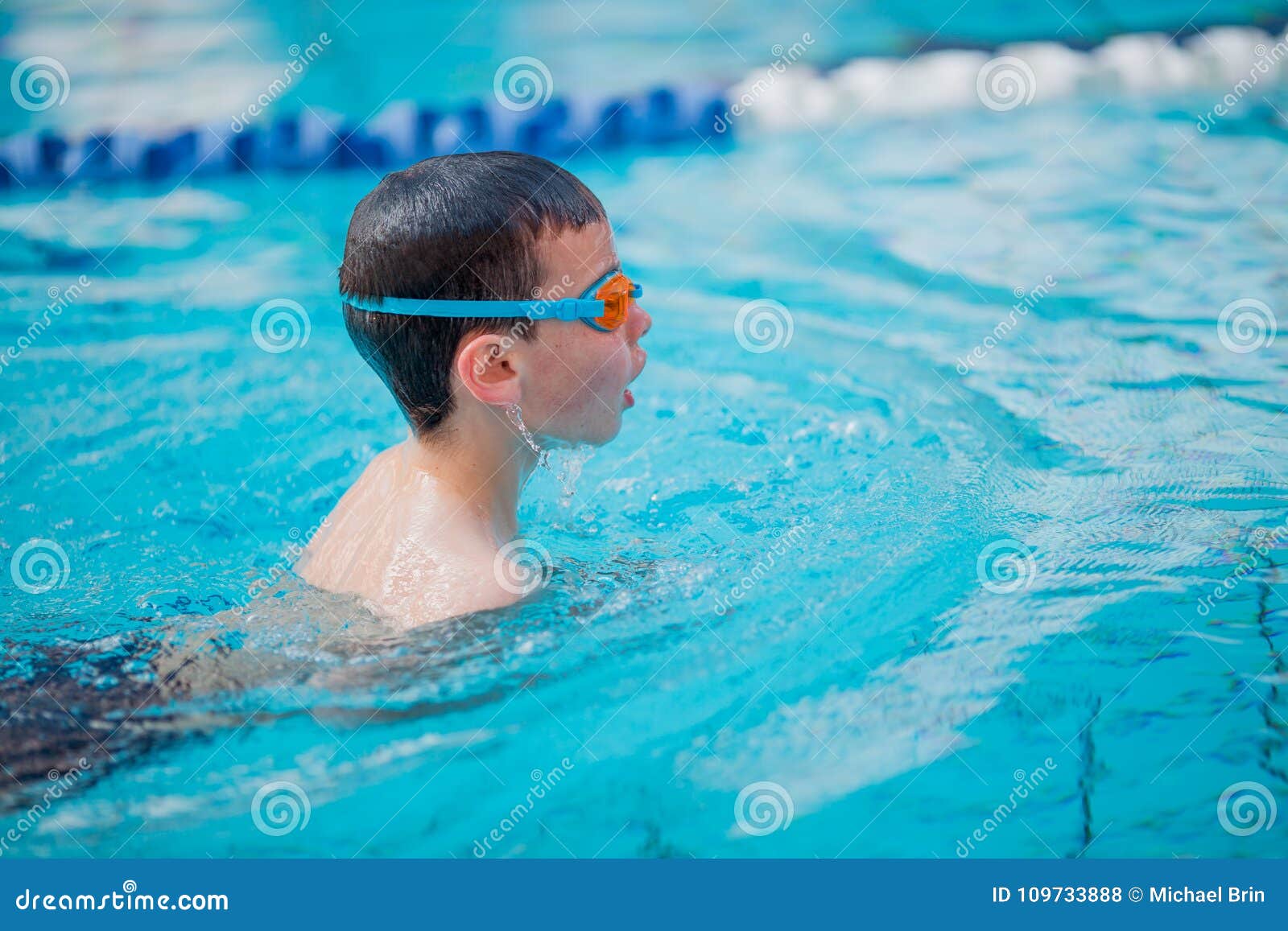 Boy swimming Freestyle stock photo. Image of athletics - 109733888