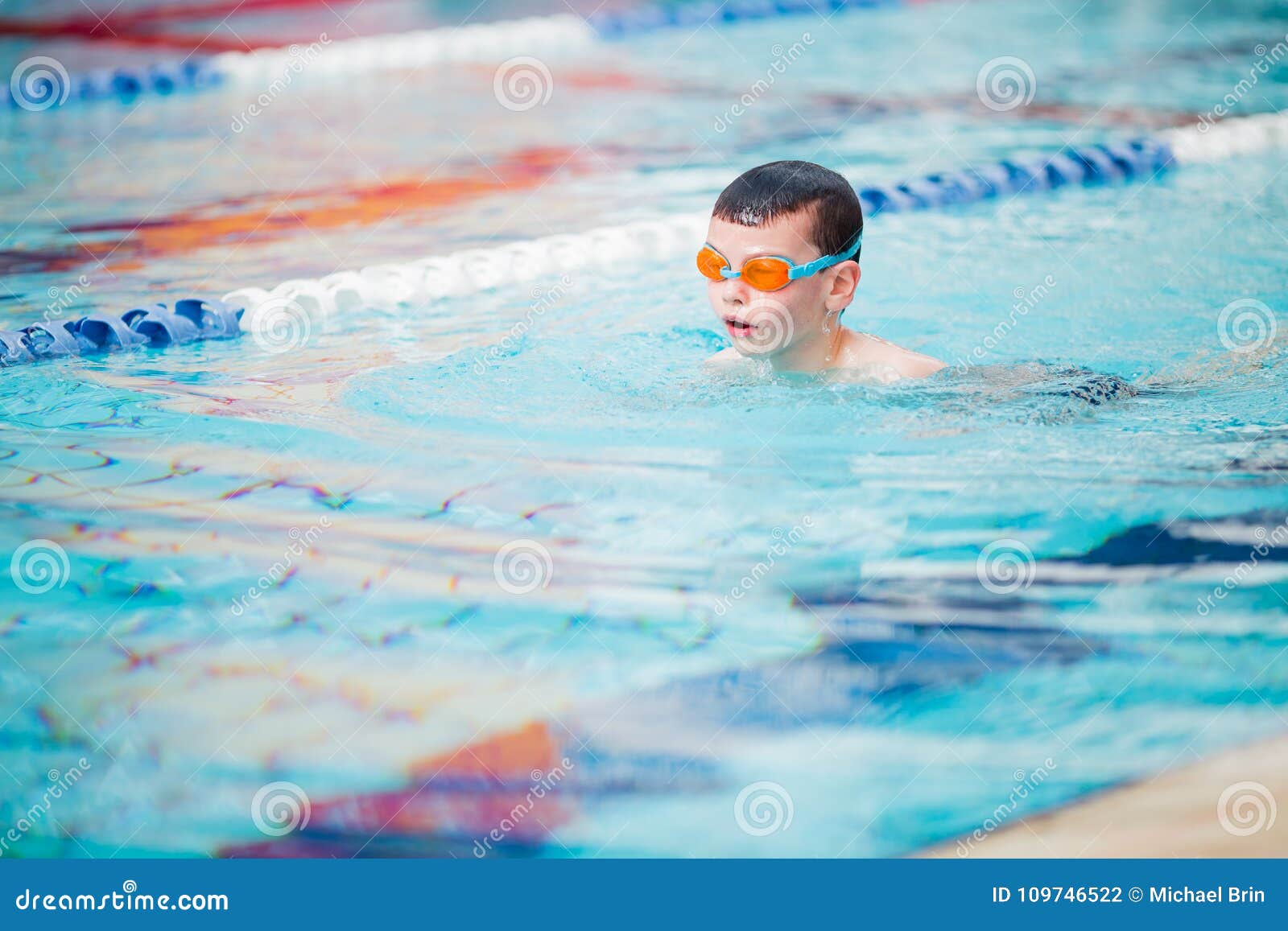 Boy swimming Freestyle stock photo. Image of fitness - 109746522