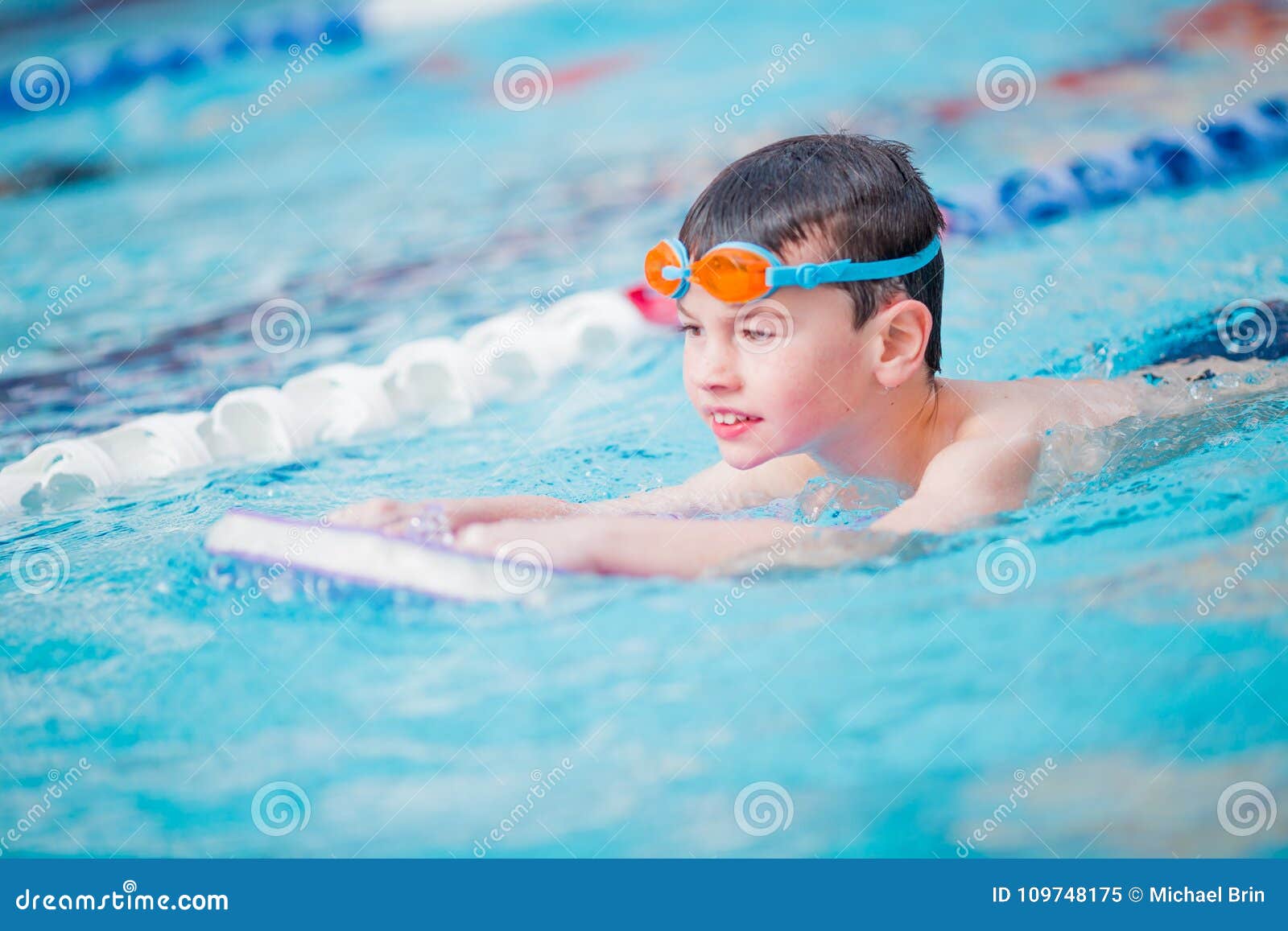 Boy swimming Freestyle stock image. Image of motion - 109748175