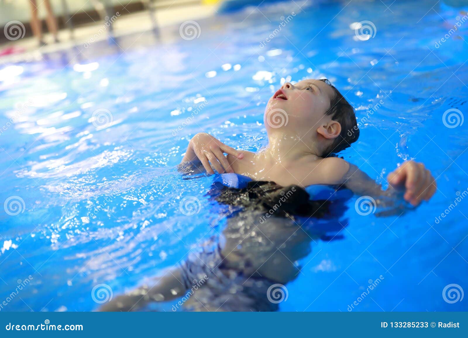 Boy swimming on his back stock image. Image of aquatic - 133285233
