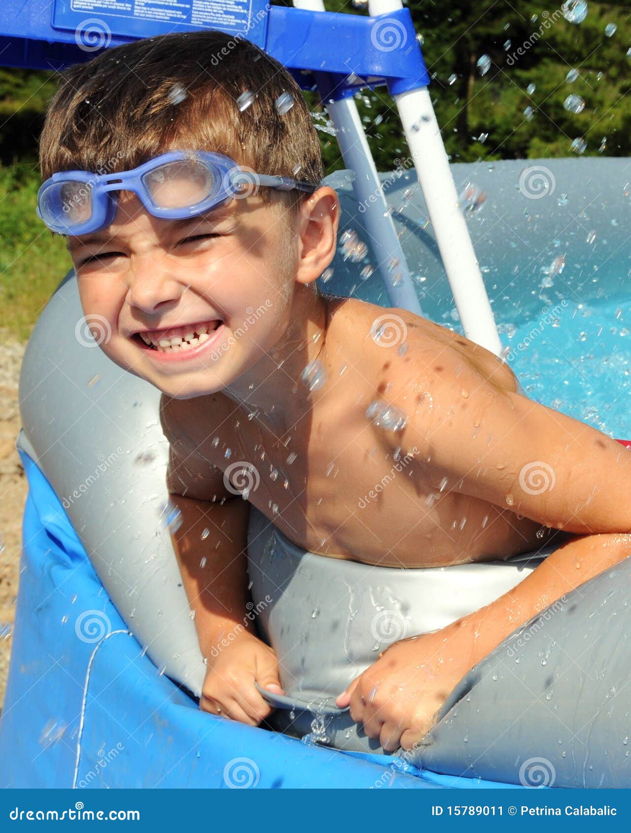 Boy in the swimming pool stock image. Image of water - 15789011