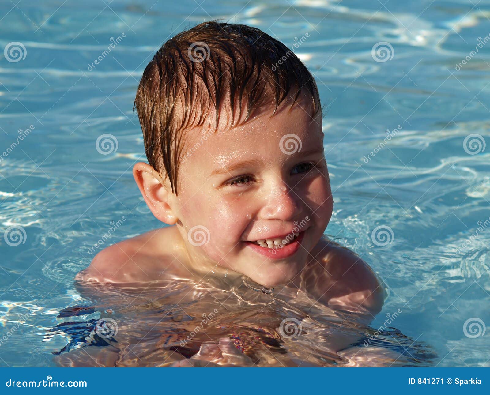 Boy in swimming pool stock image. Image of yard, swim, playing - 841271