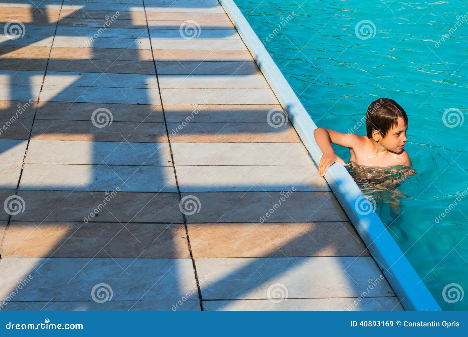 Boy in swimming pool stock image. Image of pool, edge - 40893169