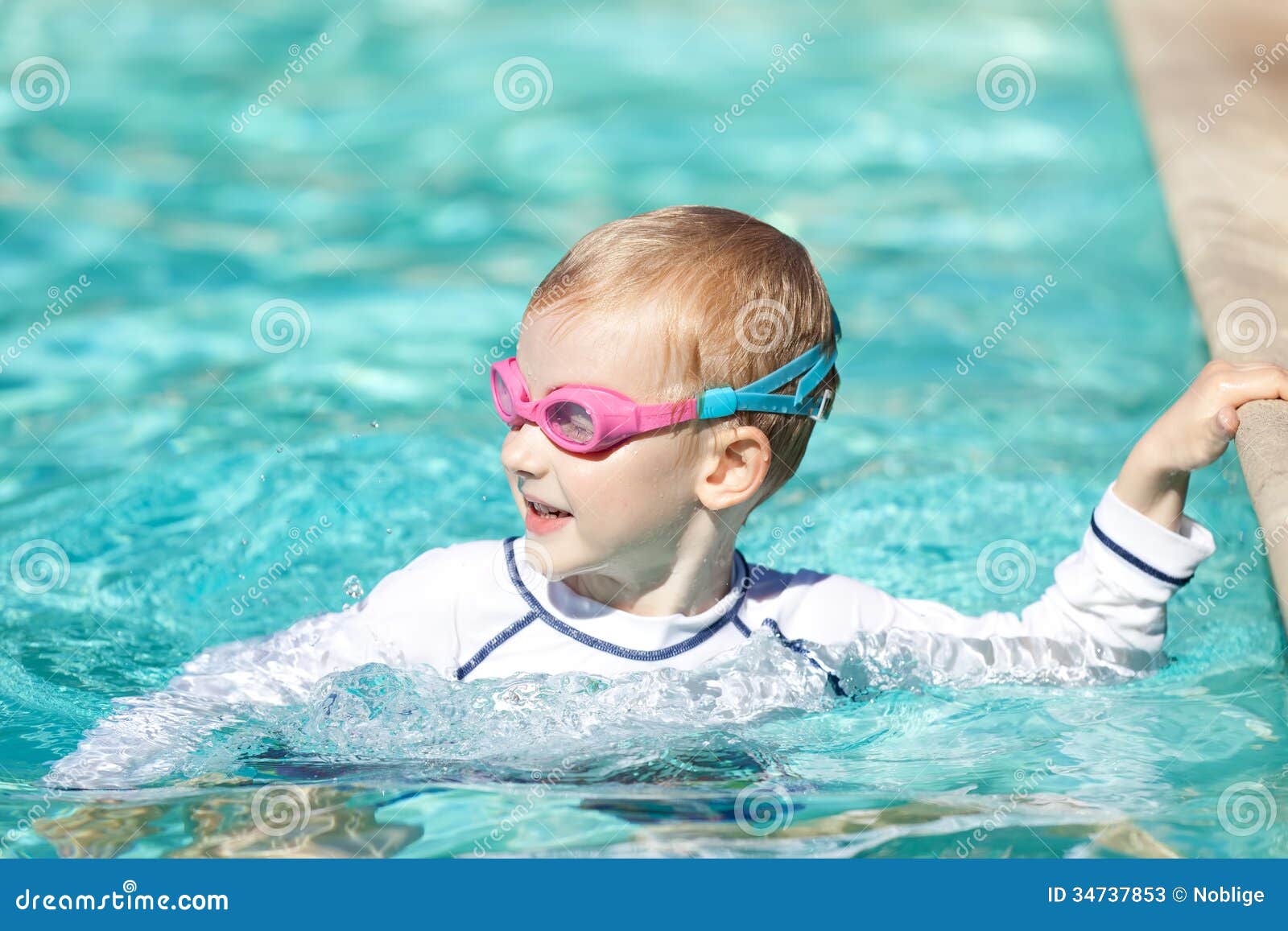 Boy at swimming pool stock image. Image of smiling, playful - 34737853