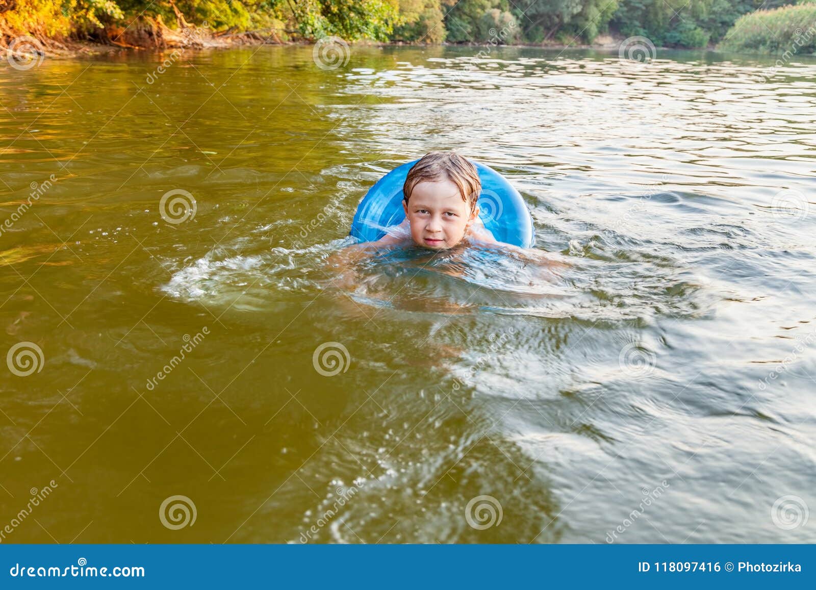 Boy Swims with Inflatable Ring Stock Photo - Image of childhood, baby ...