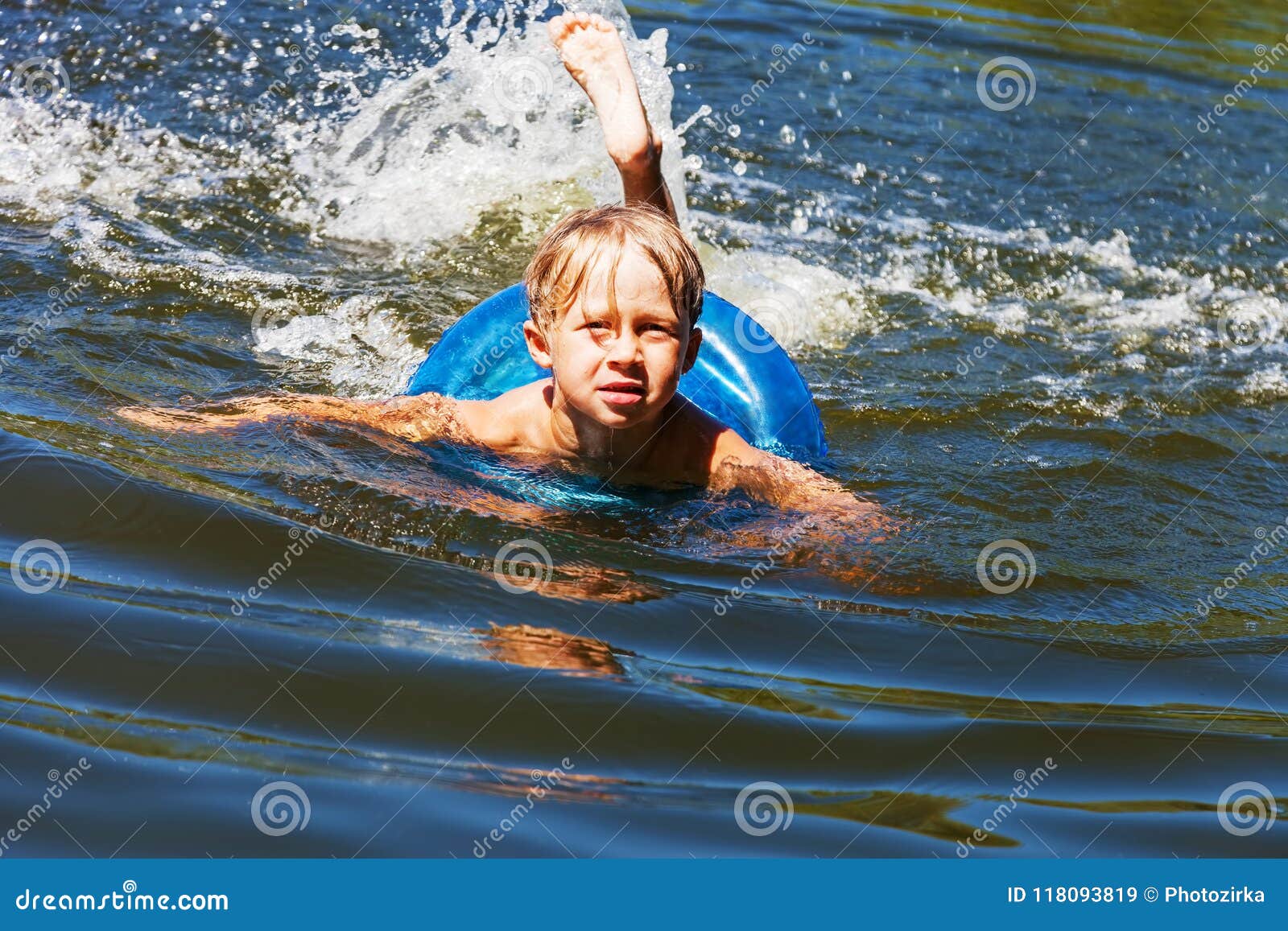 Boy Swims with Inflatable Ring Stock Image - Image of childhood, arms ...