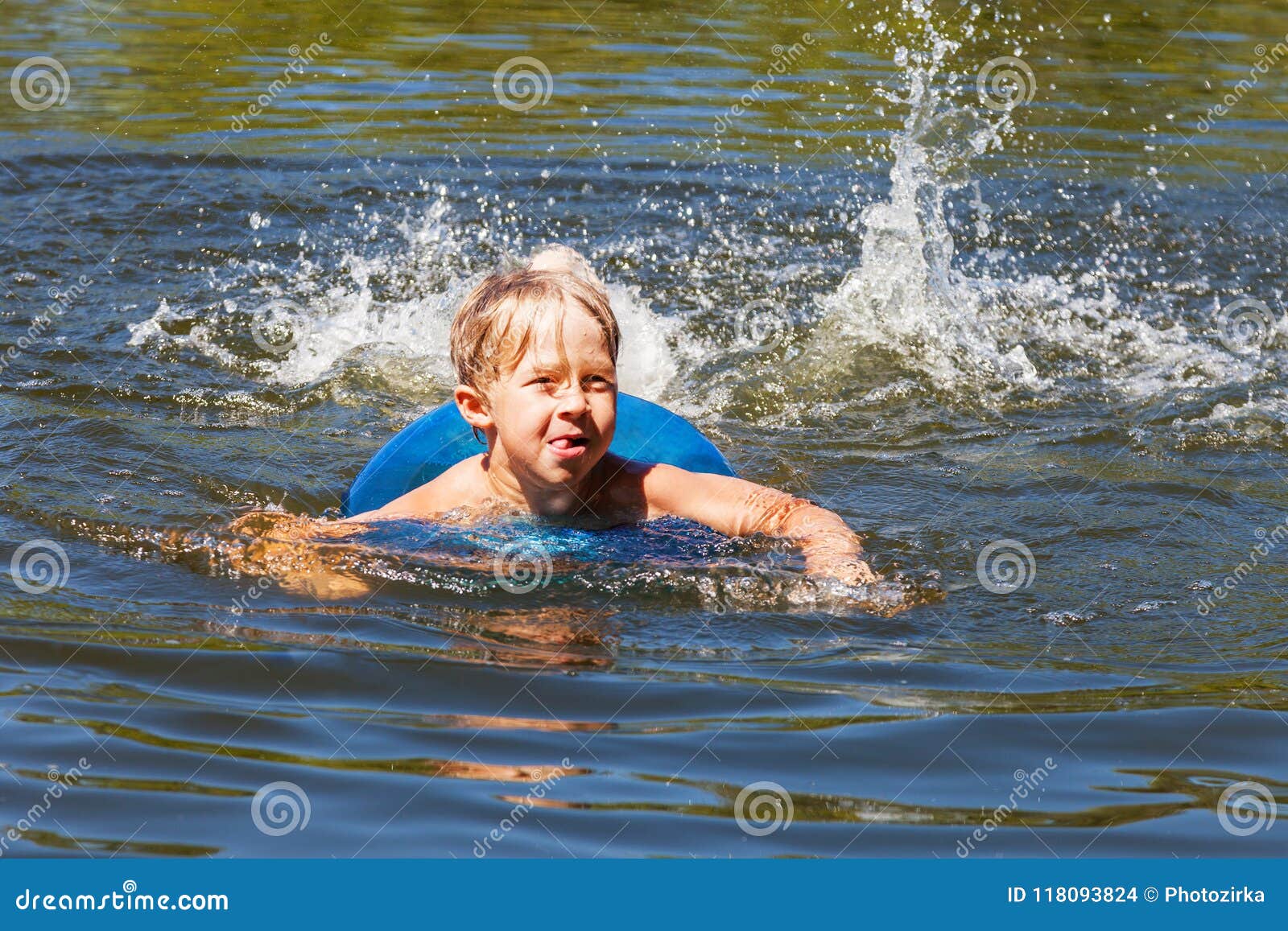 Boy Swims with Inflatable Ring Stock Photo - Image of emotions, splash ...