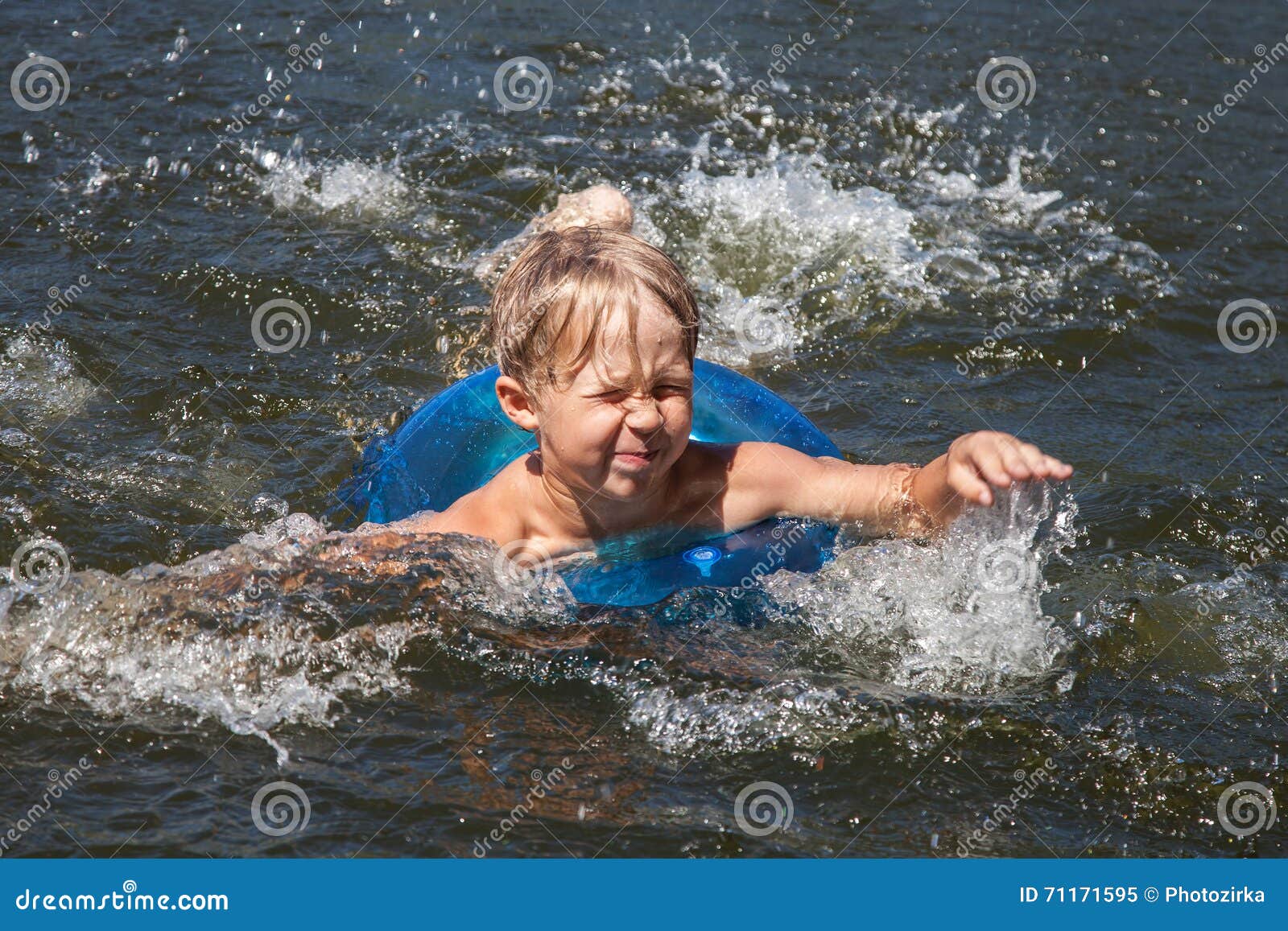 Boy Swims with Inflatable Ring Stock Image - Image of spatter, lake ...