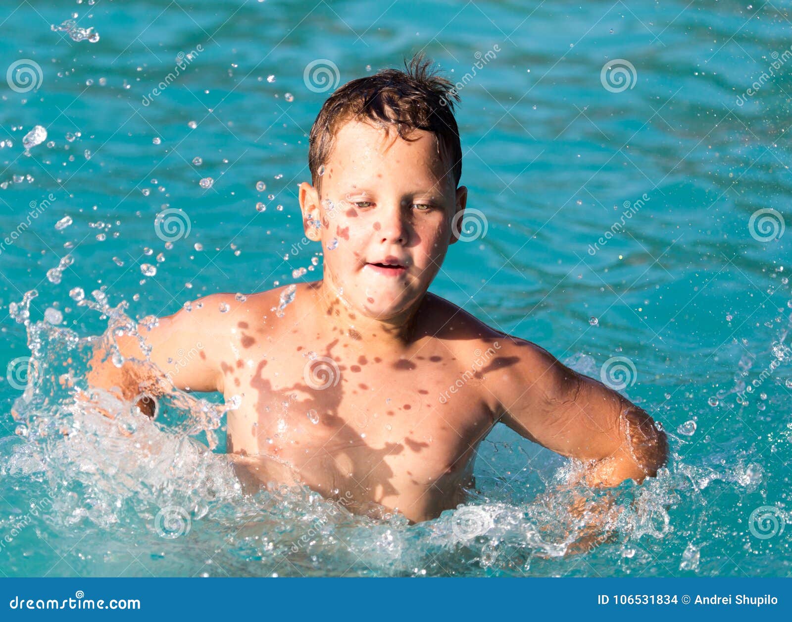 Boy Swims with a Splash in the Water Park Stock Photo - Image of child ...