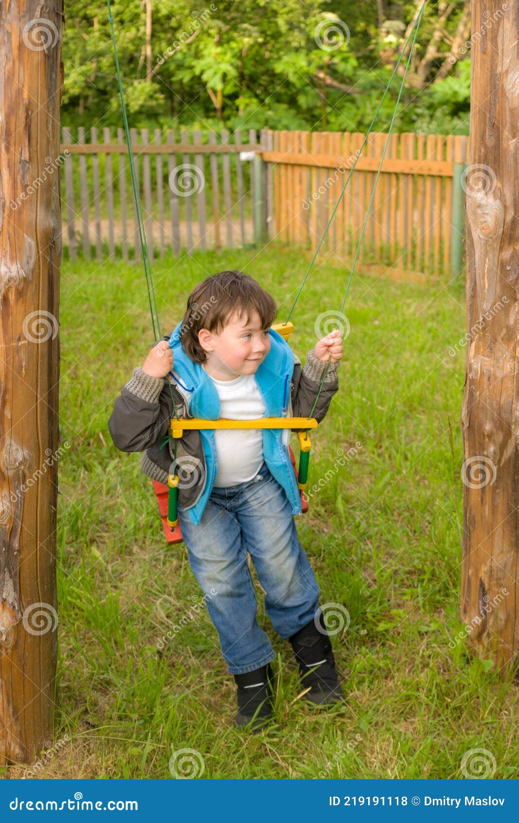 Boy on a swing in summer stock photo. Image of beautiful - 219191118