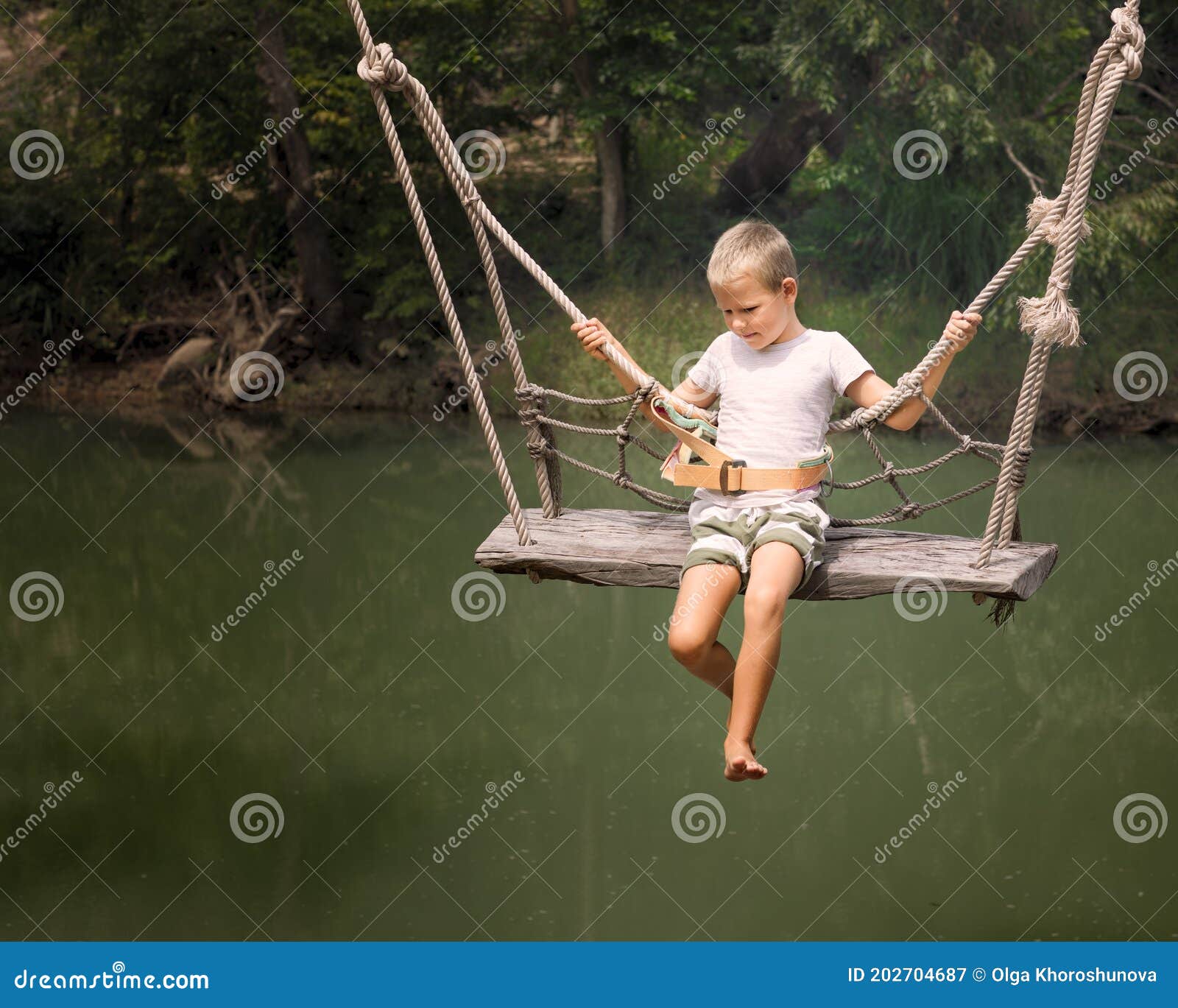 Boy Swinging on a Swing Over the River Stock Image - Image of beautiful ...
