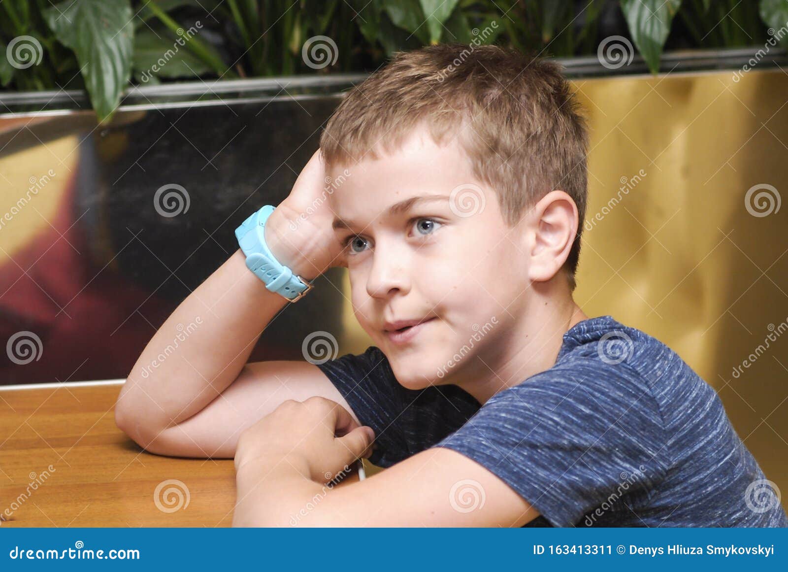 Boy at a table in a cafe stock image. Image of adorable - 163413311