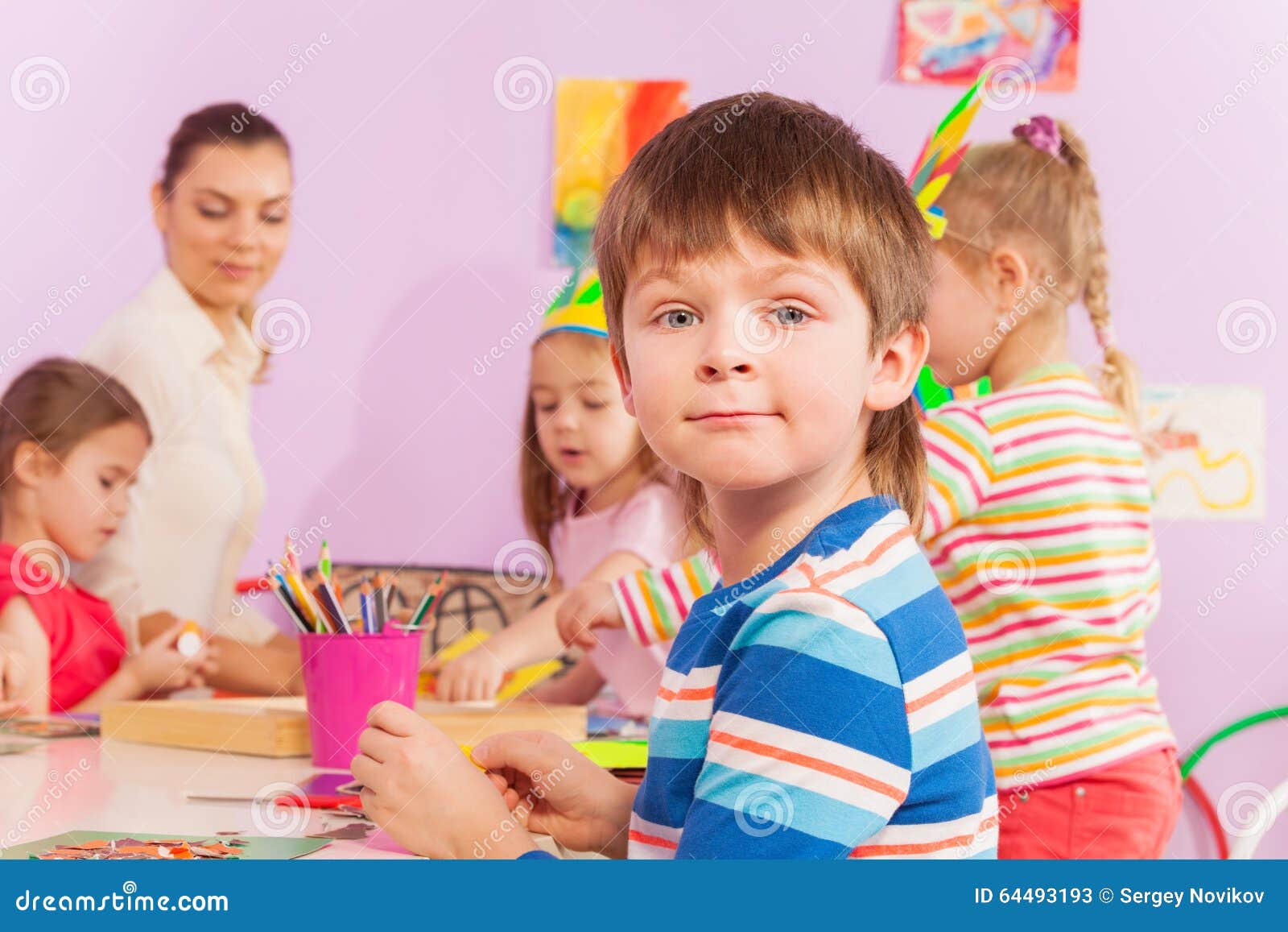 Boy by the Table in Kindergarten Class with Mates Stock Image - Image ...
