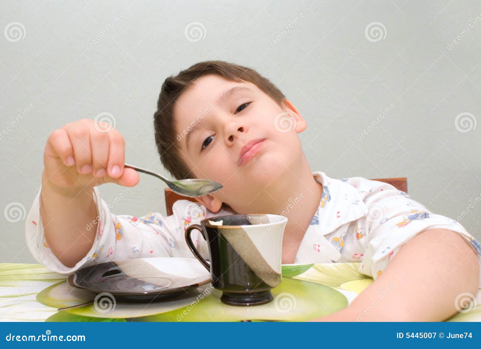 Boy at table with spoon stock image. Image of plate, leaning - 5445007