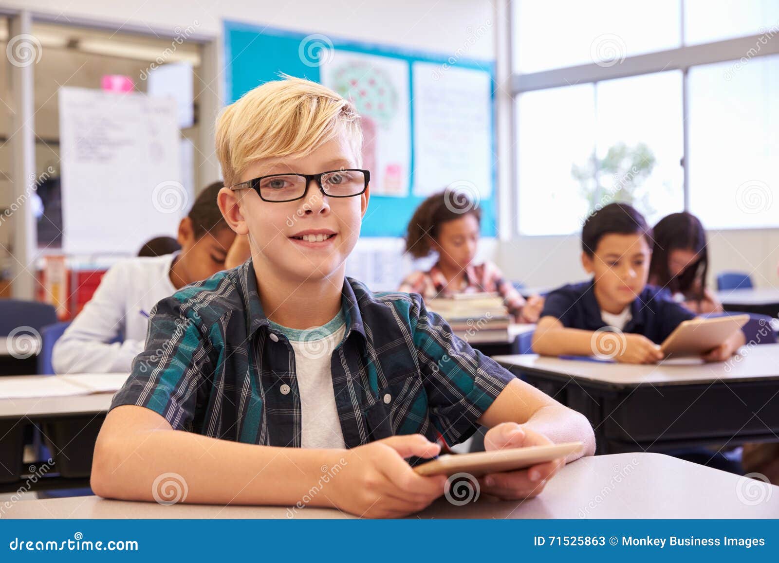 Boy with Tablet in Elementary School Class, Portrait Stock Image ...