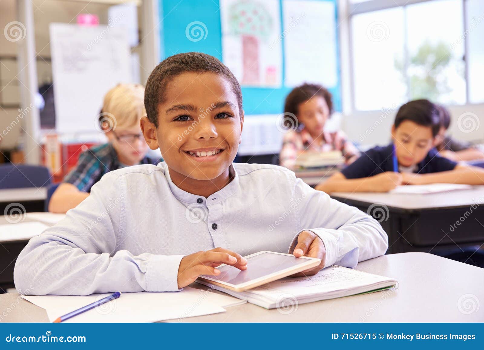 Boy with Tablet in Elementary School Class, Portrait Stock Image ...