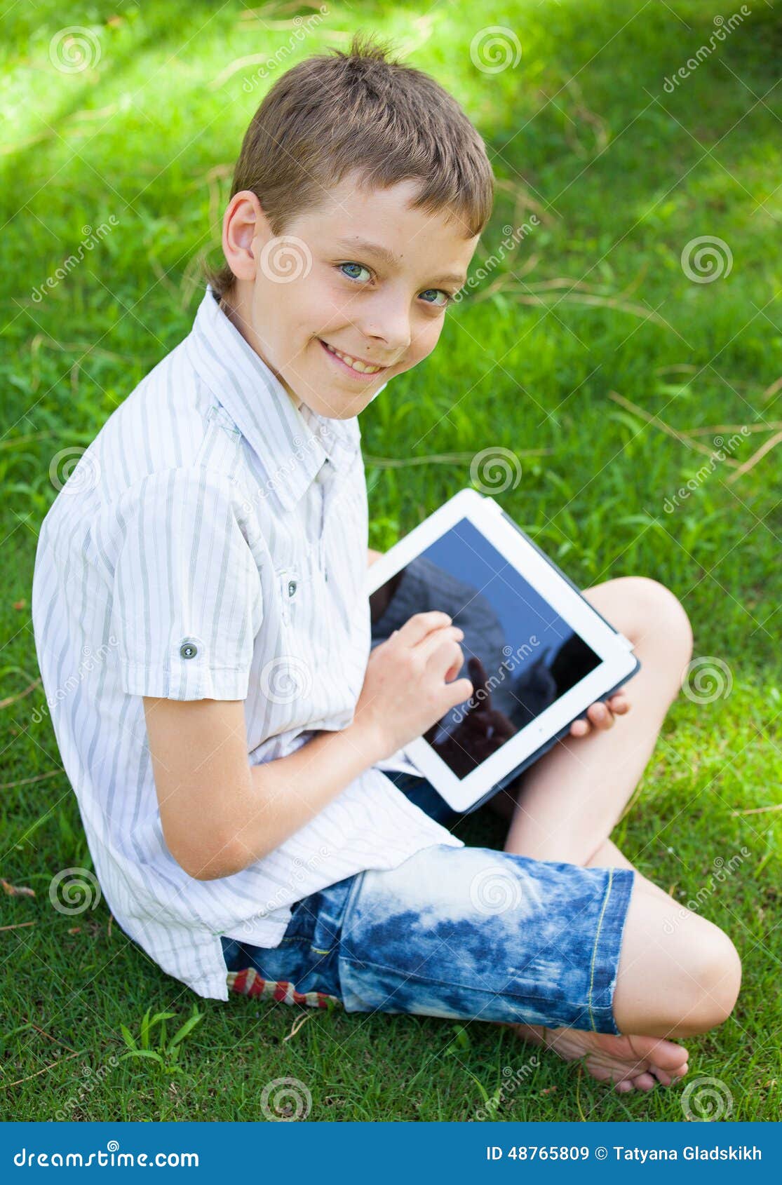 Boy with tablet stock image. Image of computer, beautiful - 48765809