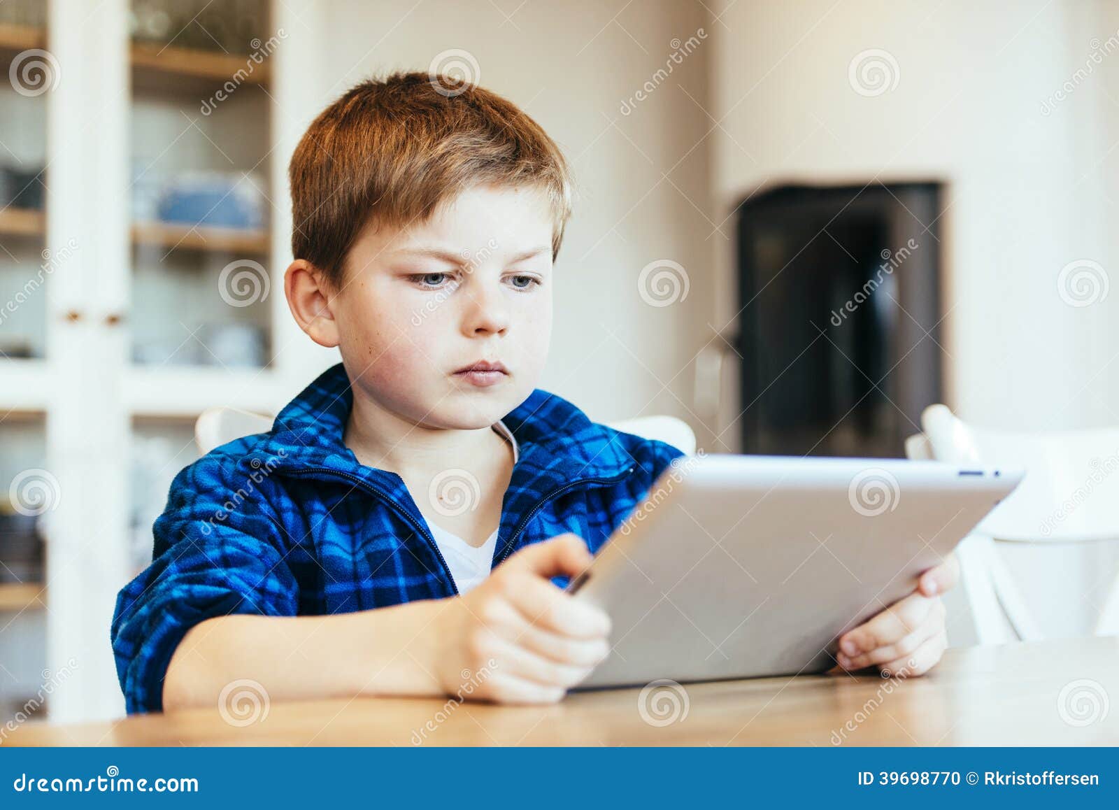 Boy with tablet stock photo. Image of play, sitting, connection - 39698770