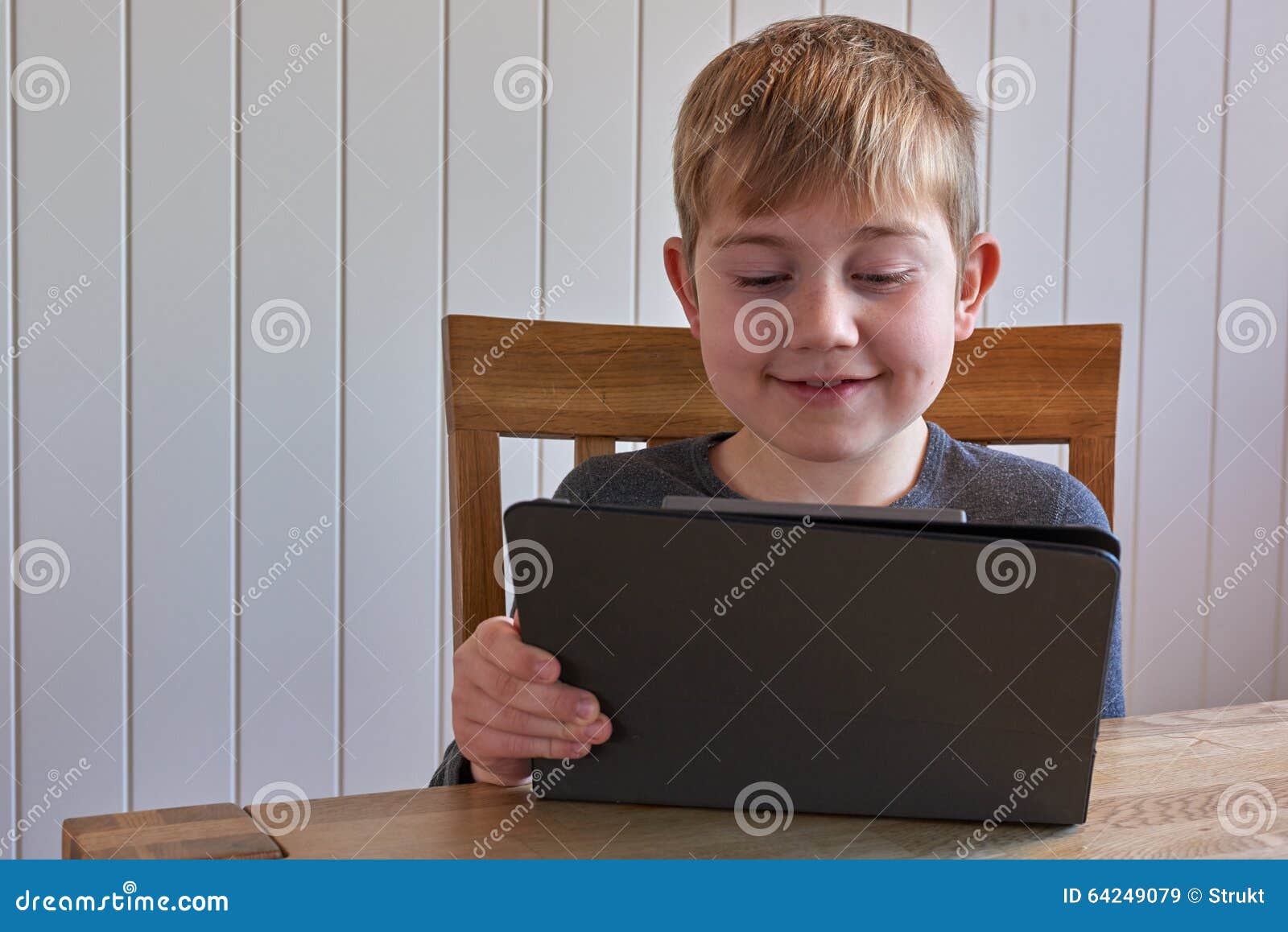 Boy with Tablet stock image. Image of caucasian, playing - 64249079