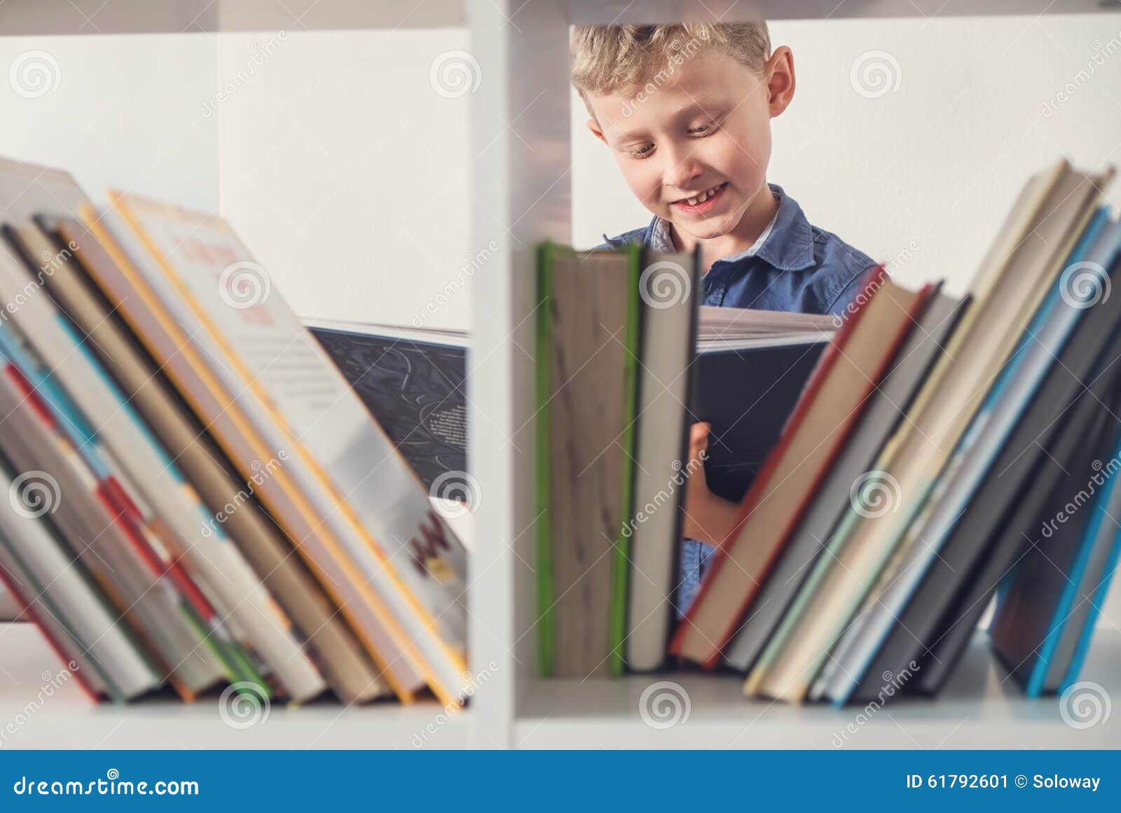 Boy Take a Book from the Book Shelf Stock Image - Image of library ...