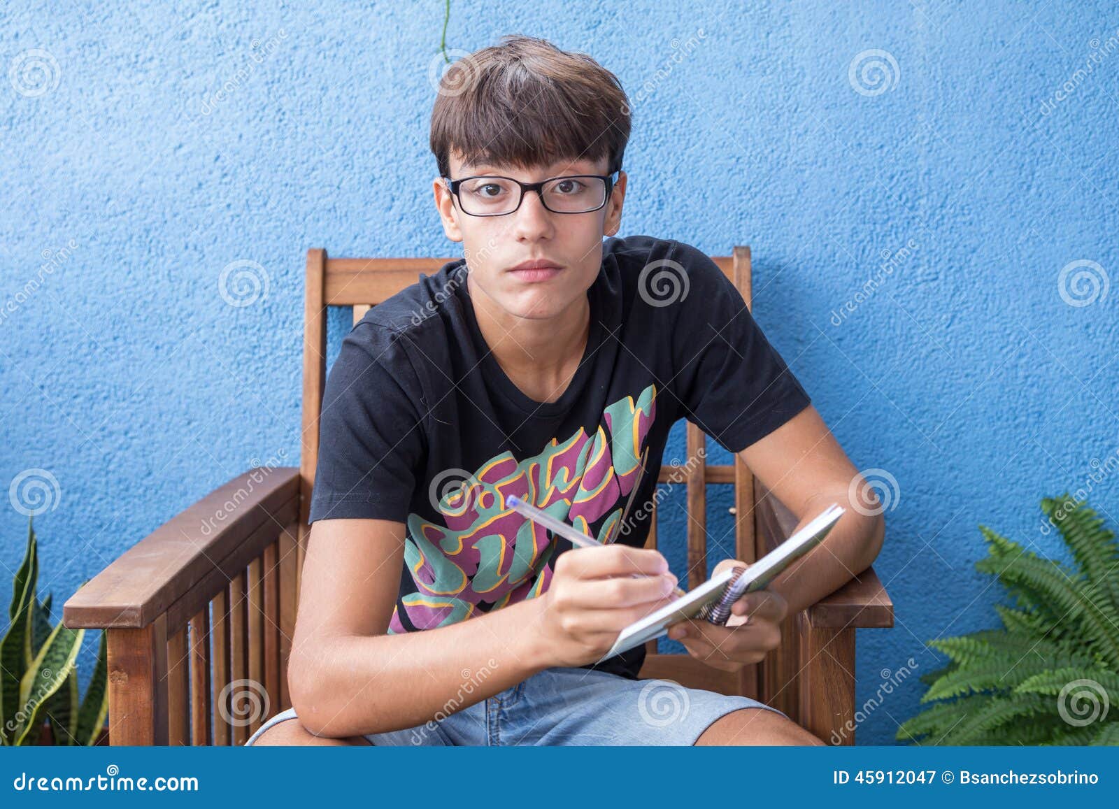 The Boy Takes Notes in Notepad Stock Image - Image of caucasian, young ...