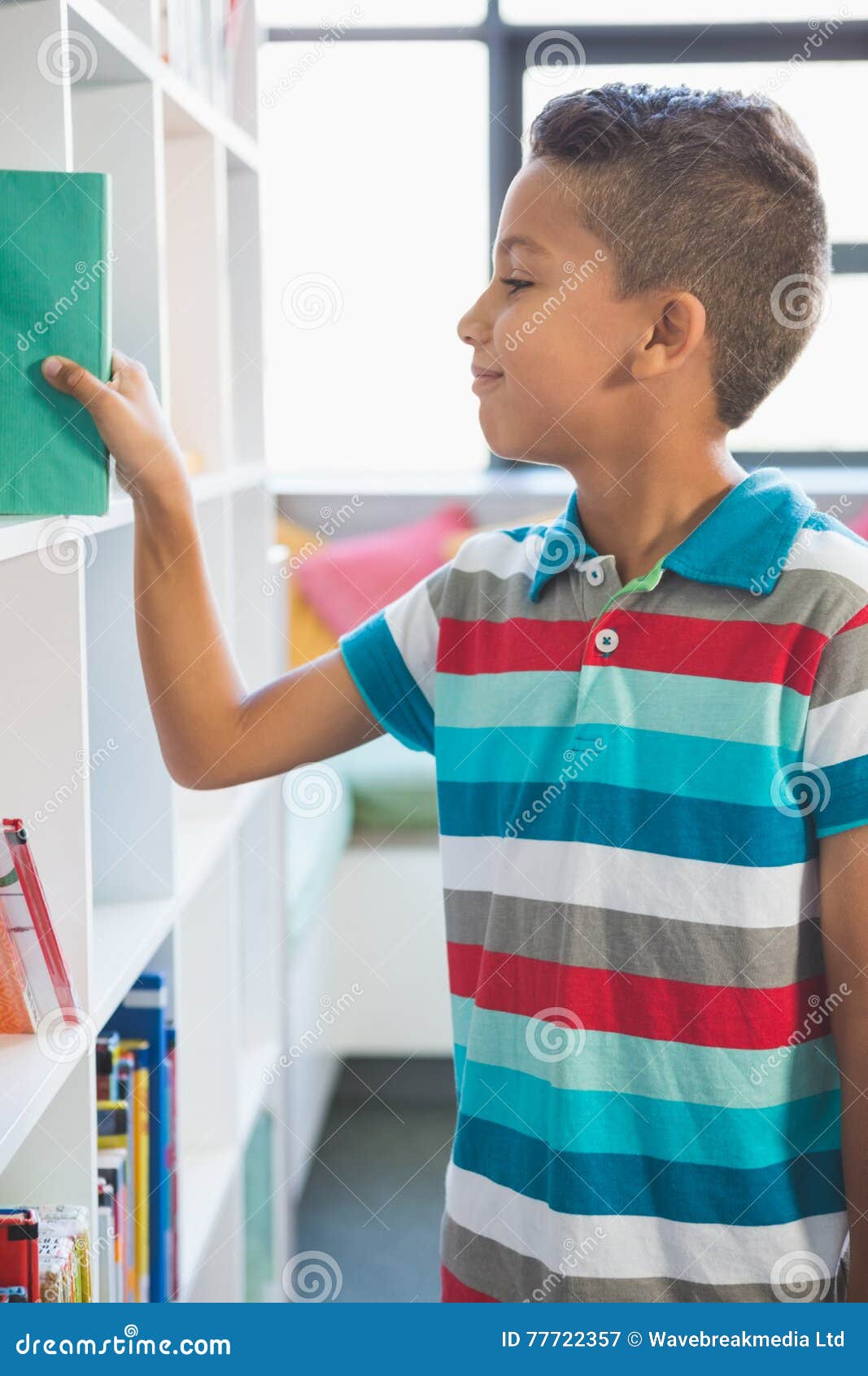Boy Taking a Book from Bookshelf in Library Stock Image - Image of ...