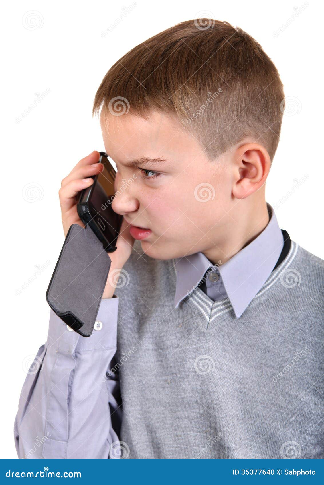 Boy talking on Cellphone stock photo. Image of irritation - 35377640