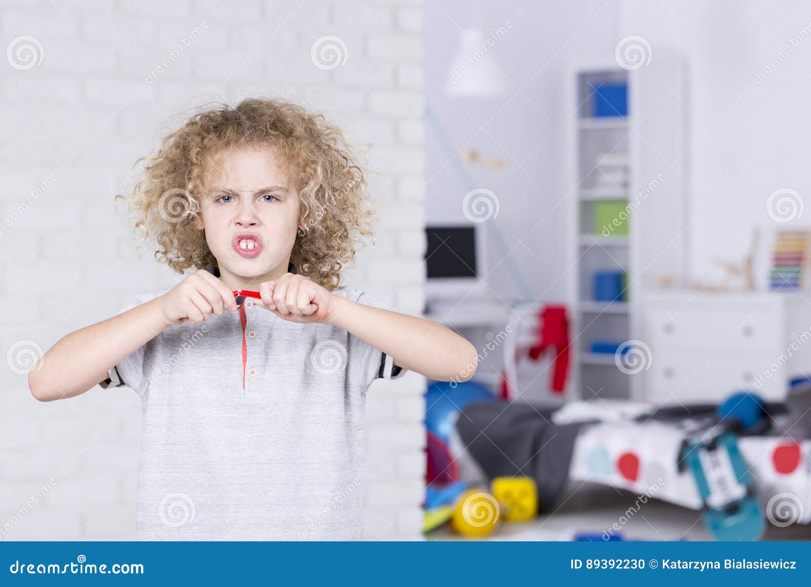 Boy tearing the pencil stock photo. Image of determined - 89392230