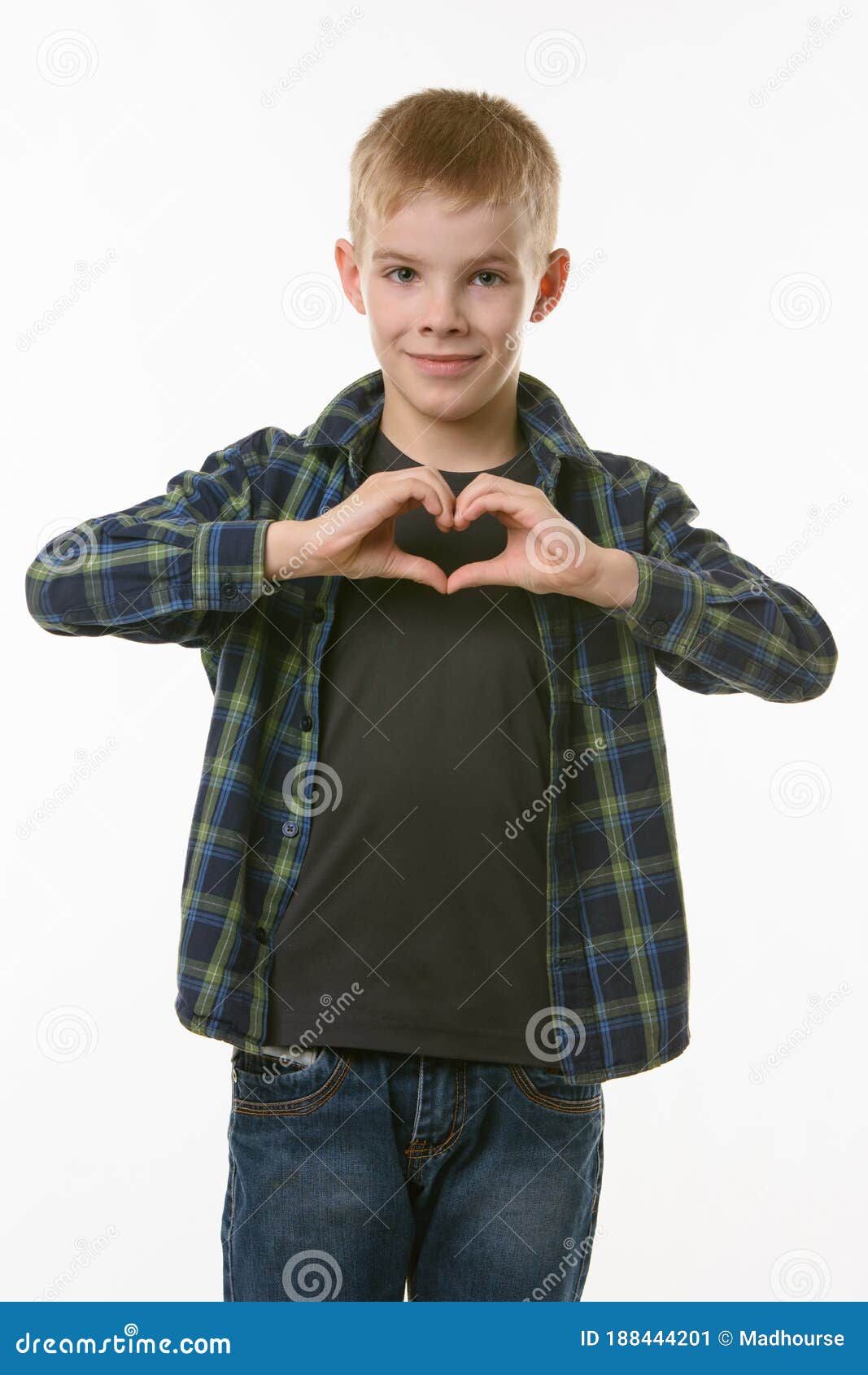 A Boy of Ten Years Shows a Heart with Two Hands on His Chest Stock ...
