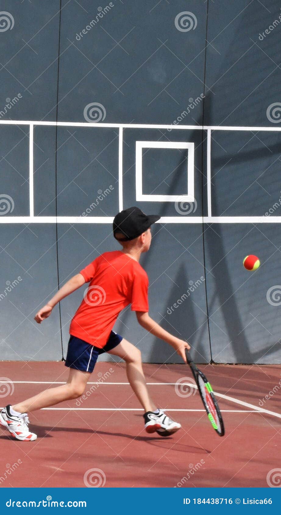 Boy with a tennis racket stock photo. Image of racket - 184438716