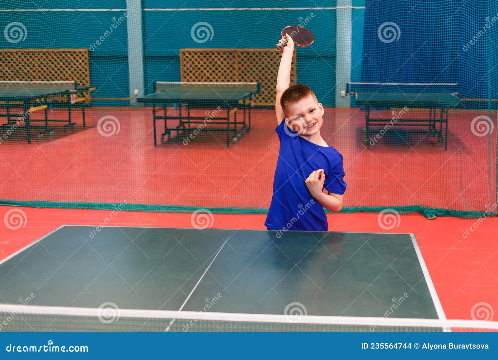 A Boy with Tennis Rackets in His Hands. the Joy of Victory Stock Photo ...