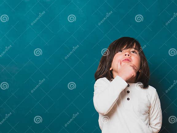Boy Thinking in Front of the Classroom Blackboard. Stock Image - Image ...